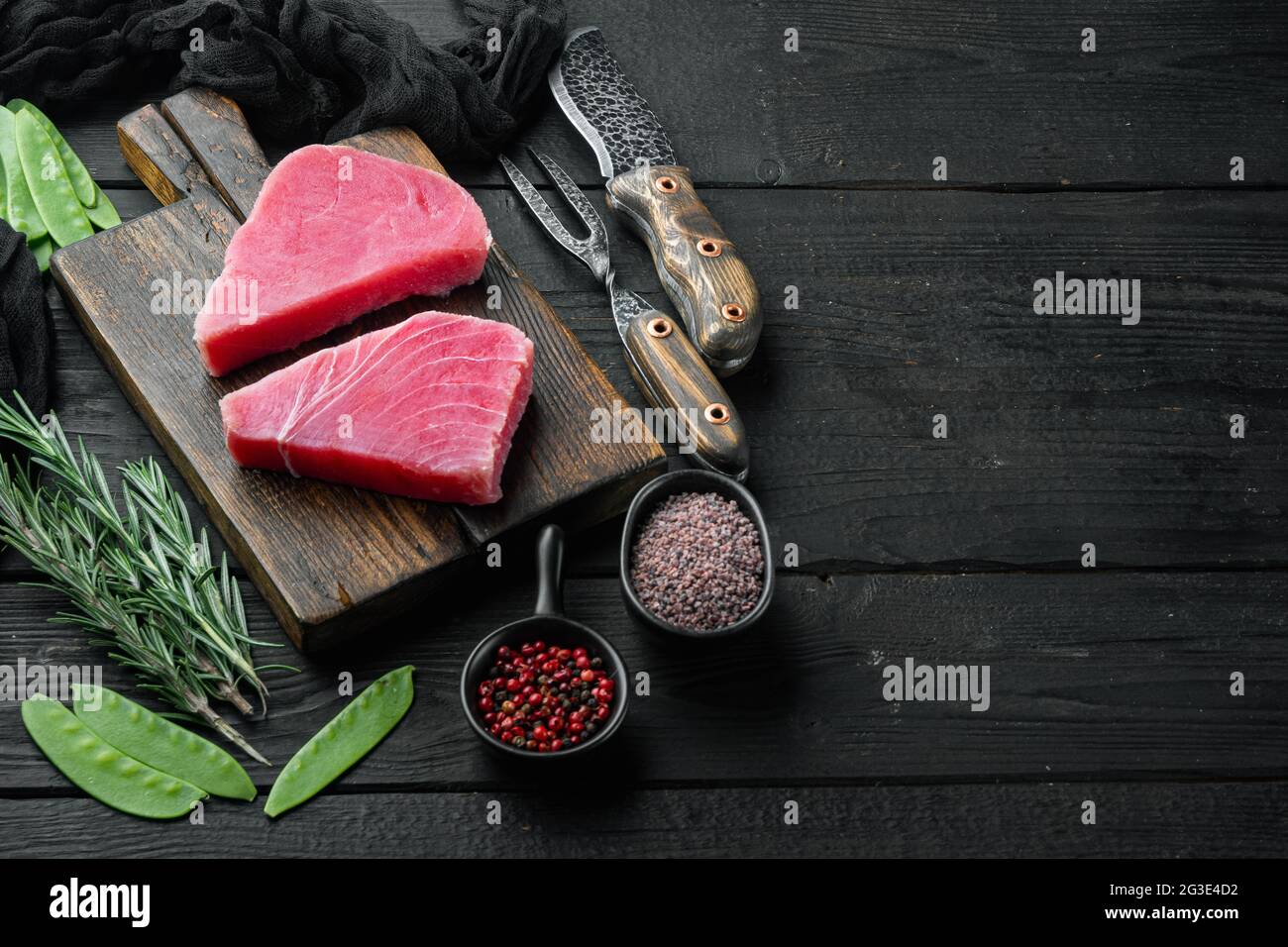 Raw tuna steak, fresh red tuna fillet with ingredients, green pea ...