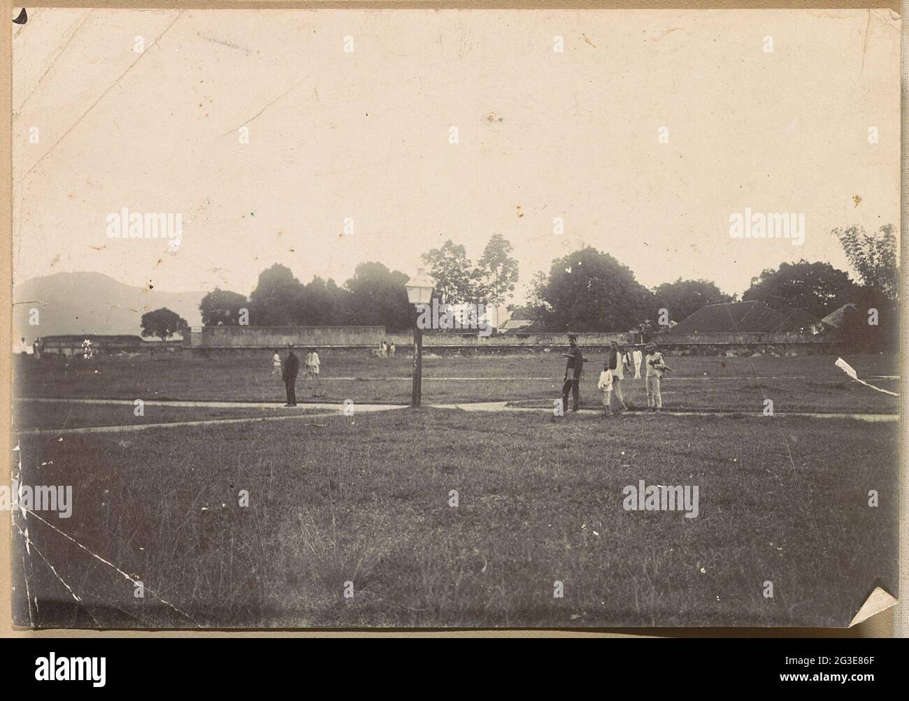 Men and children on a lawn at Fort new Victoria on Ambon. The rebuilt ...