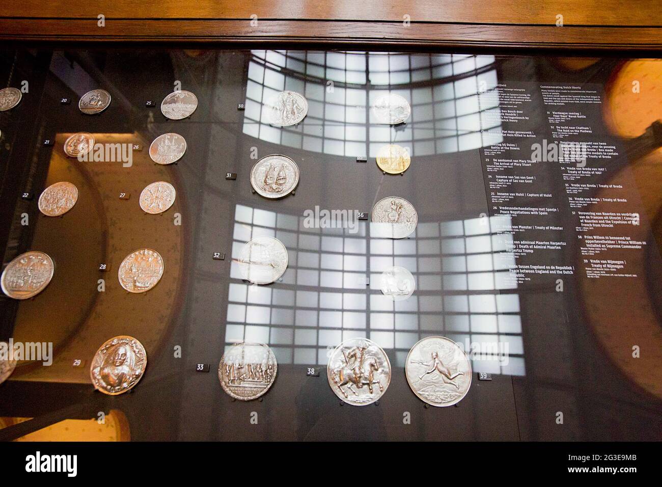 Detail display with coins and tokens on library bordes Stock Photo - Alamy