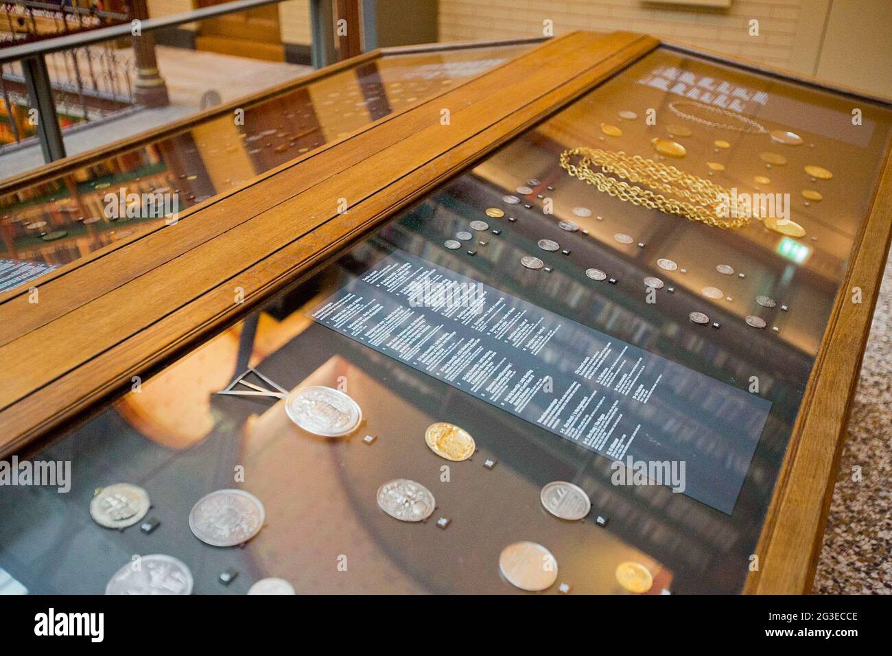 Detail display with coins and tokens on library bordes Stock Photo - Alamy