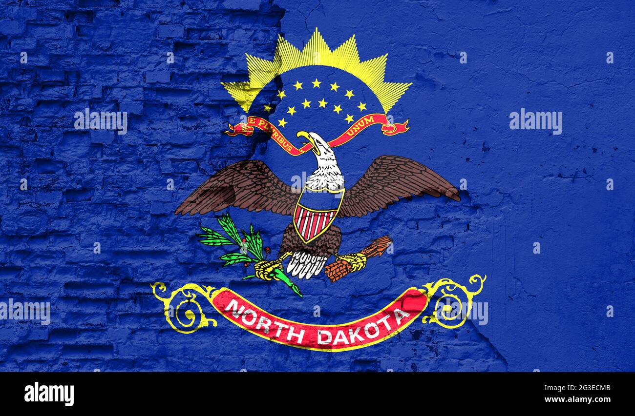 State of North Dakota flag is painted onto an old brick wall Stock ...