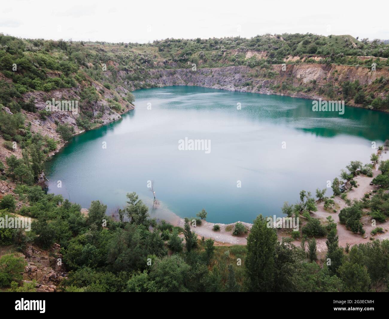 overhead top view of flooded mine lake with blue water copy space Stock ...