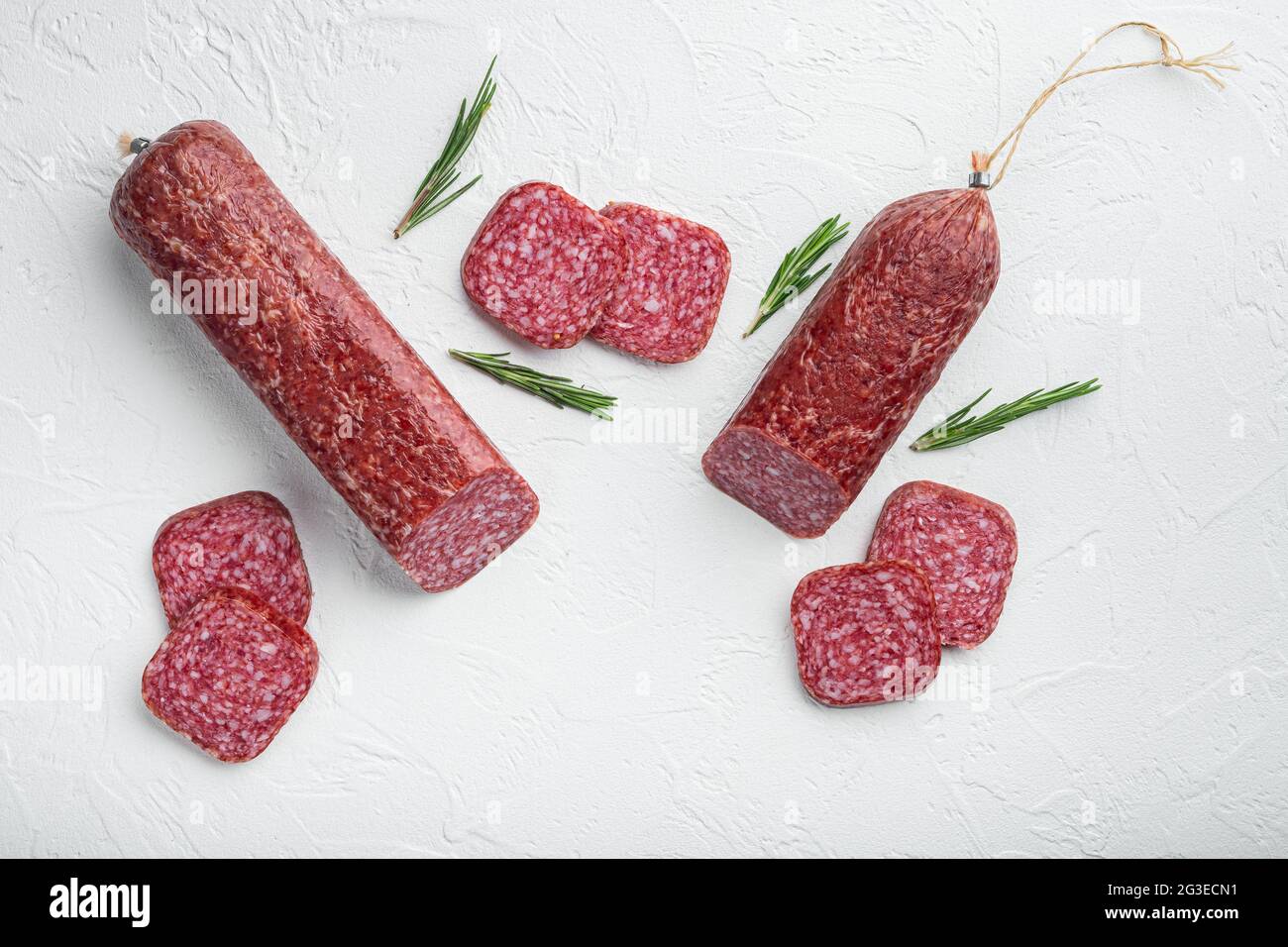 Salami with ingredients set, on white stone table background, top view ...