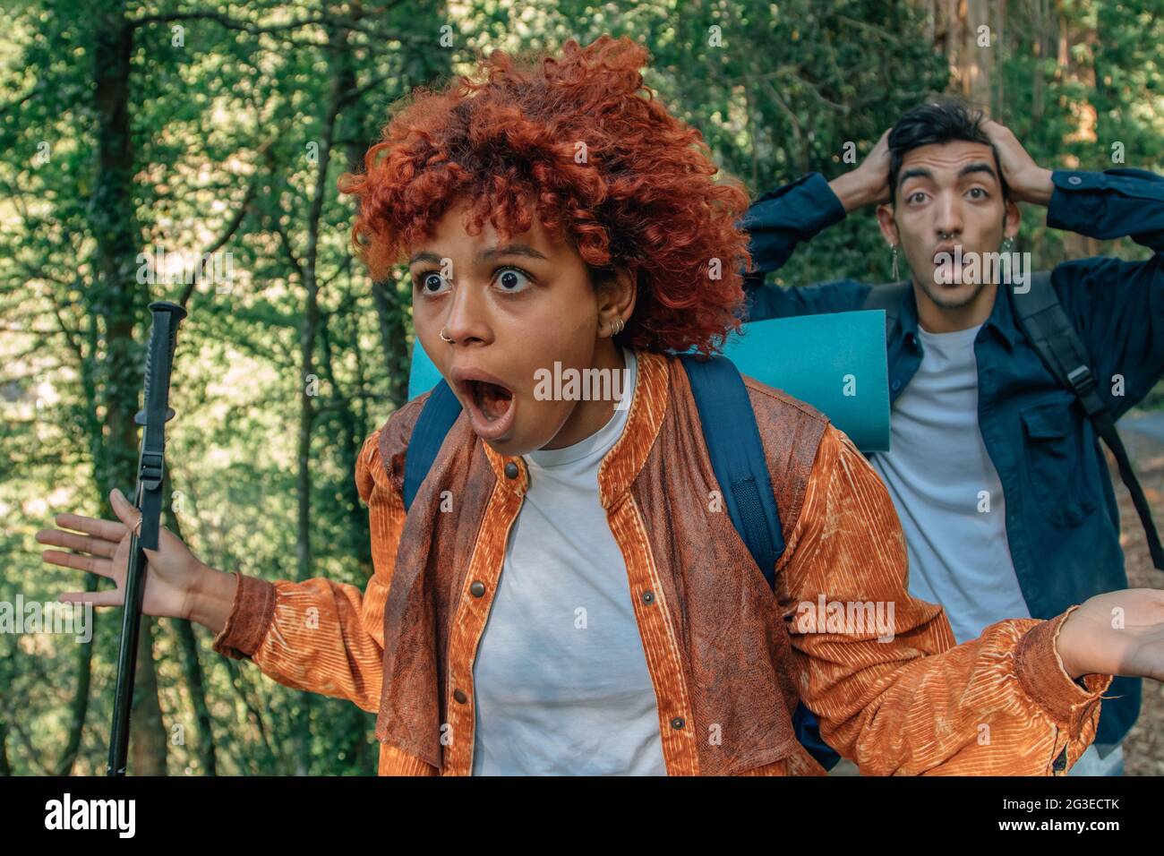 young people with backpack amazed and surprised Stock Photo - Alamy