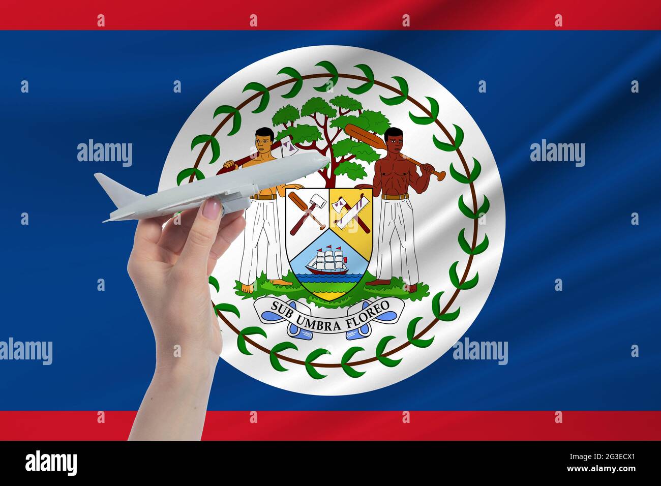 Airplane in hand with national flag of Belize. Travel to Belize Stock ...