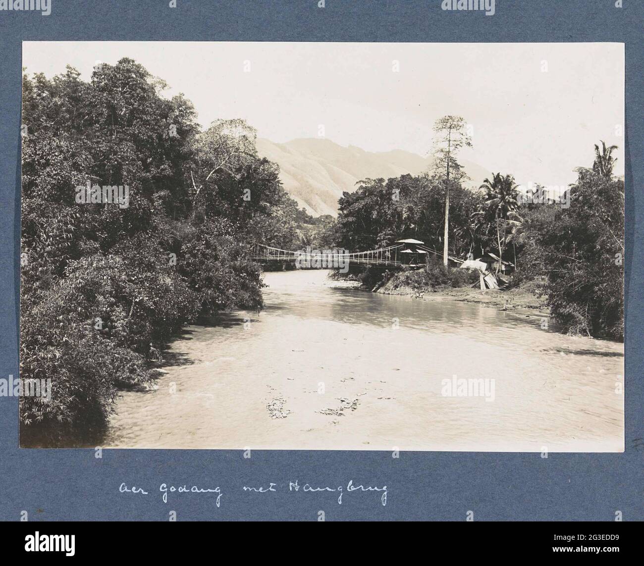 Suspension bridge over a river in AEK Godang on Sumatra. Part of travel ...