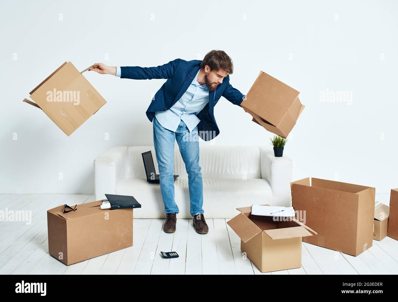 business man boxes with things moving to a new place of work unpacking ...