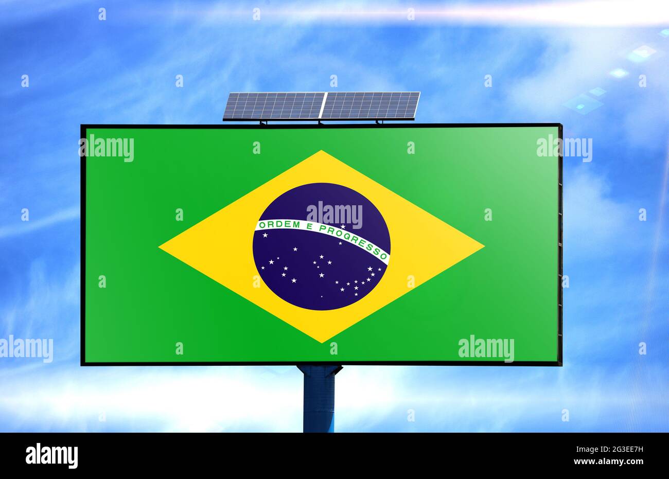 Billboard with Brazil flag and solar battery on blue sky background ...