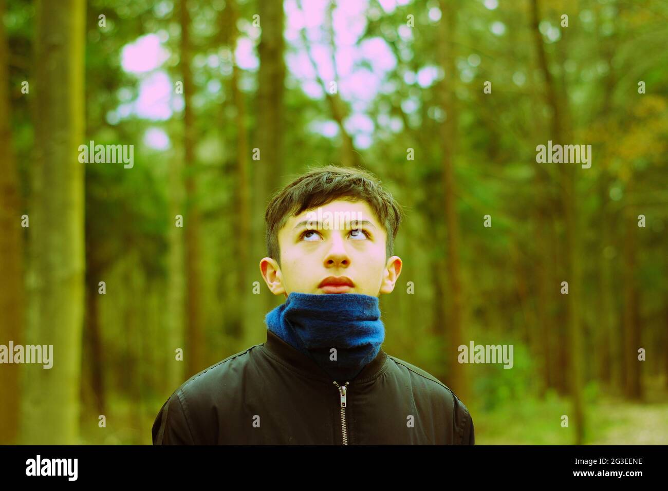 Cute teenager looking up at the sky in winter Stock Photo - Alamy