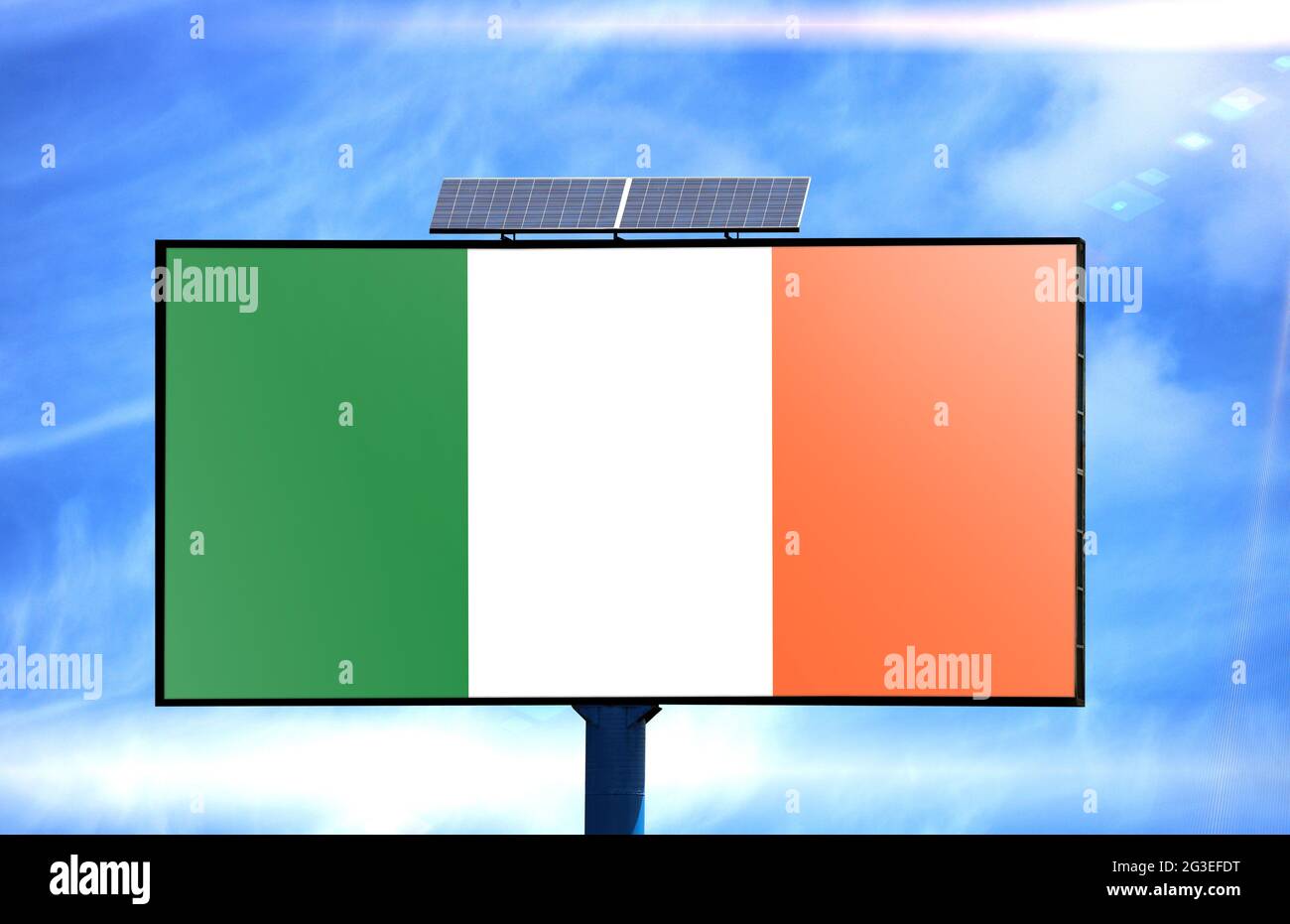 Billboard with Ireland flag and solar battery on blue sky background ...