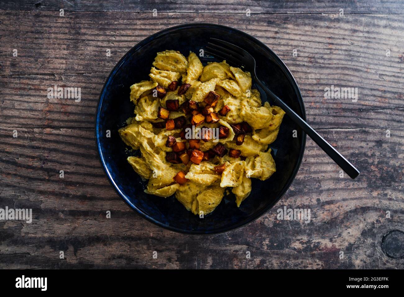 vegan creamy pumpkin pasta with roasted pumpkin cubes as topping ...