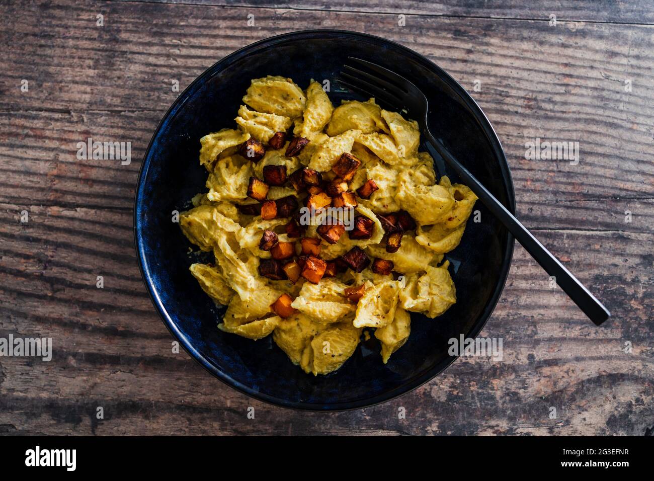 vegan creamy pumpkin pasta with roasted pumpkin cubes as topping ...