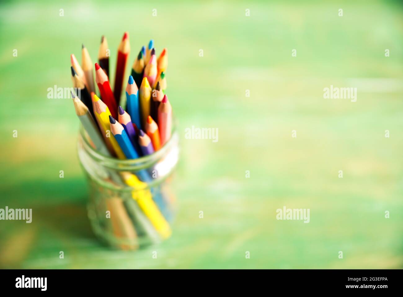 Colored pencils in a glass Stock Photo - Alamy