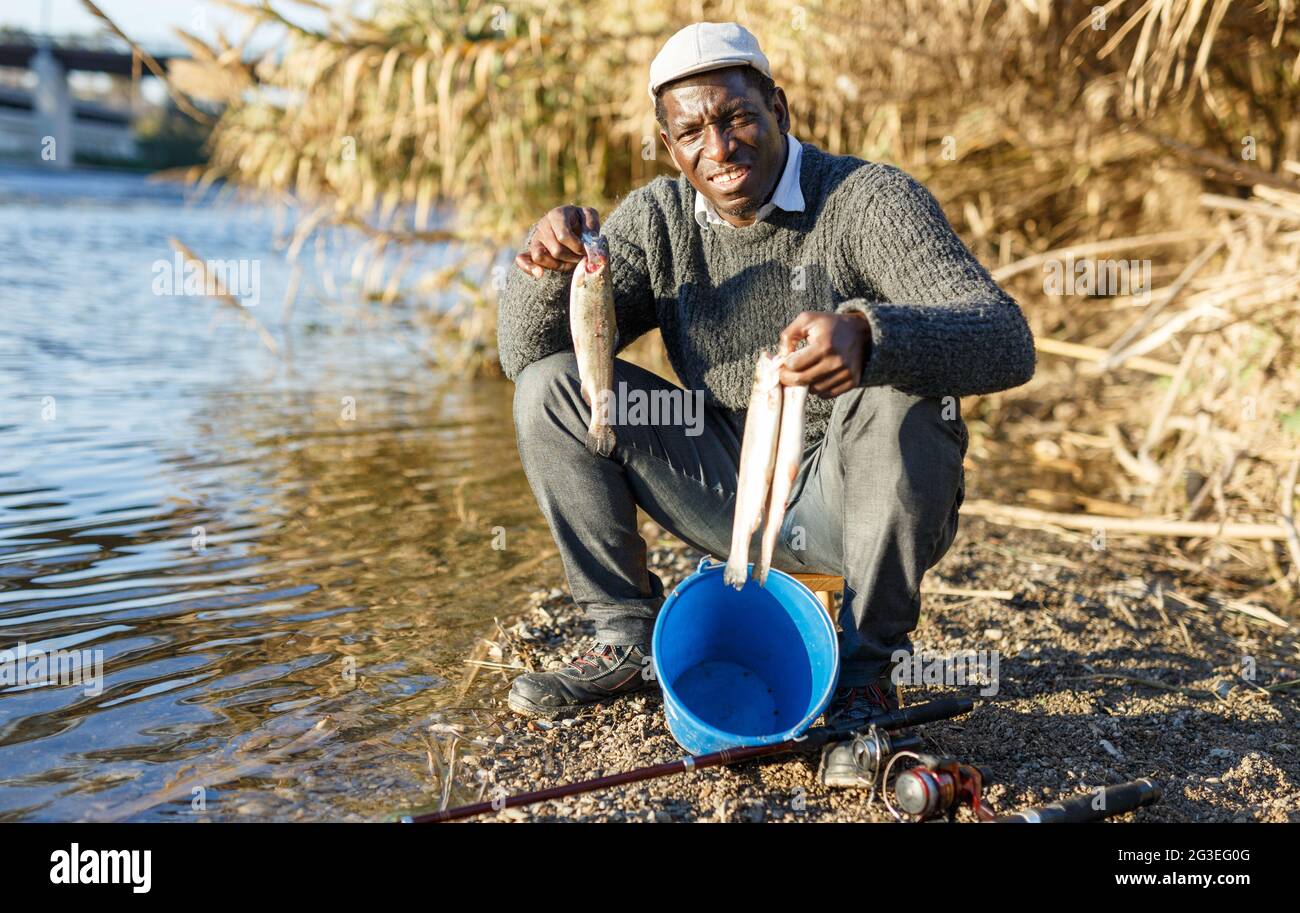 Fishman hands hi-res stock photography and images - Alamy