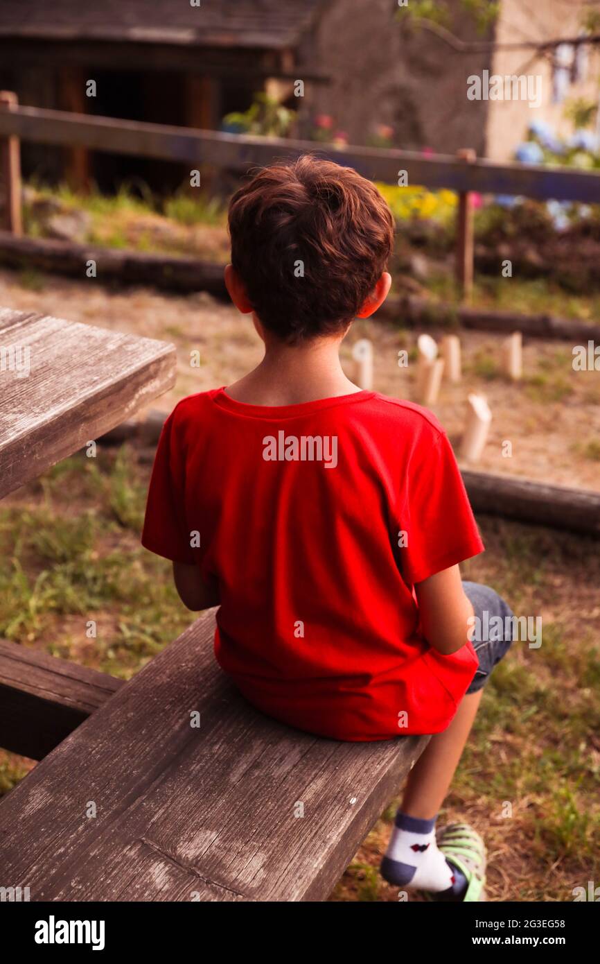 Back view of child sitting Stock Photo - Alamy