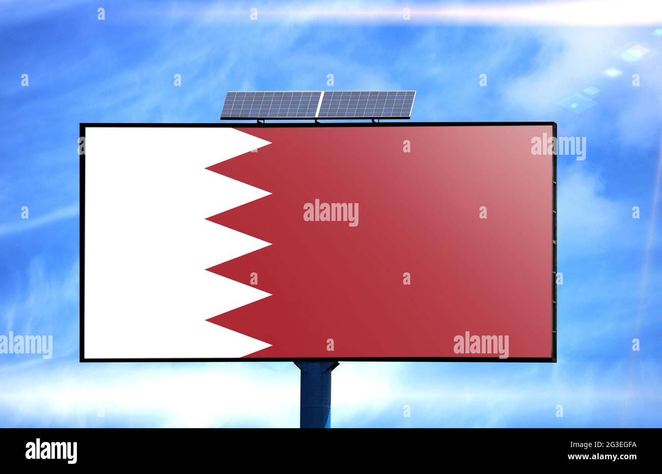 Billboard with Bahrain flag and solar battery on blue sky background ...