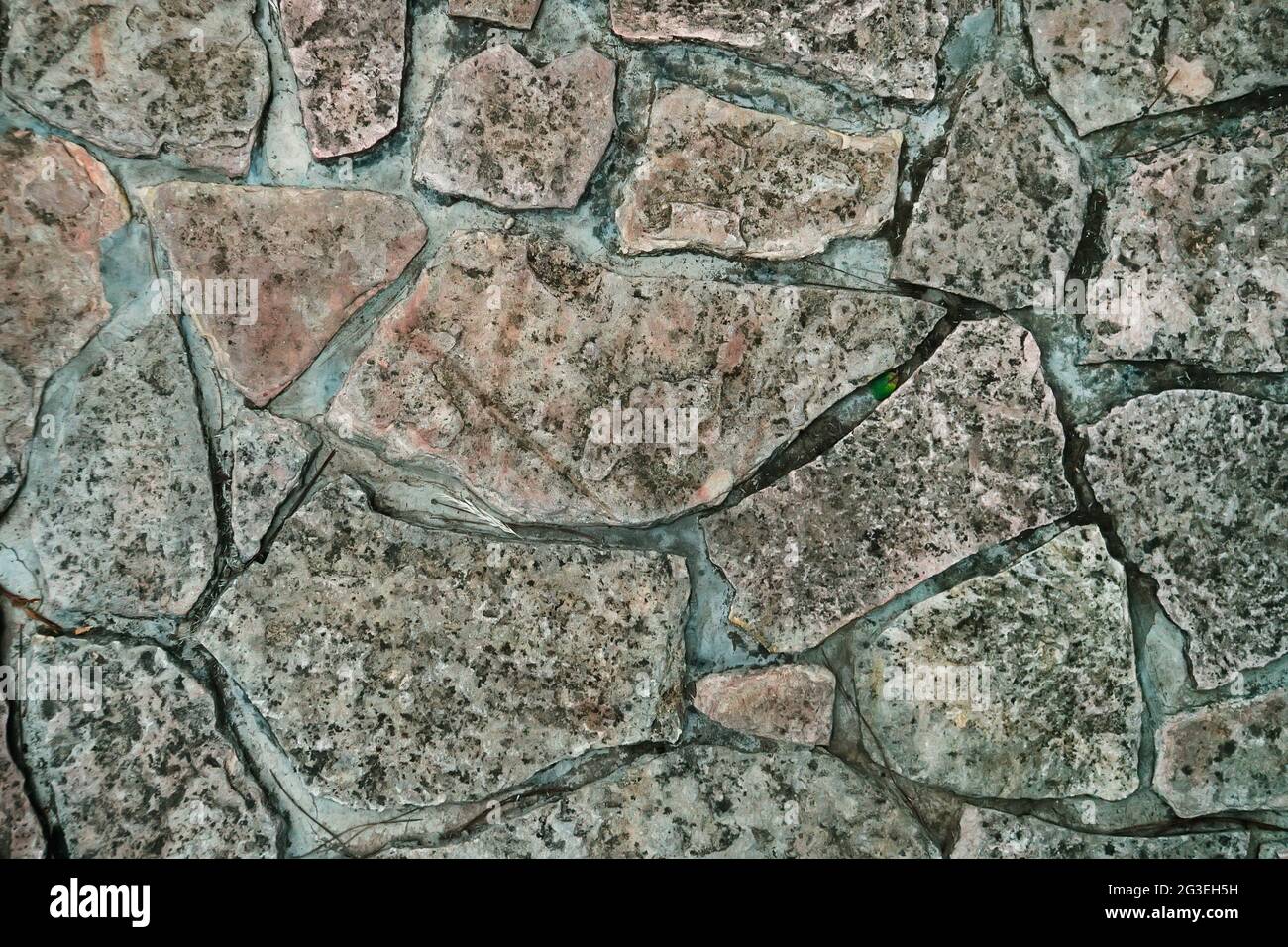 Rustic floor ceramic tile with stone texture. Close up of a stone path ...