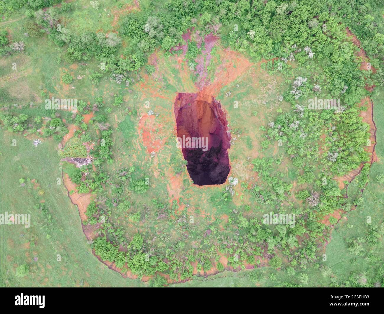 overhead view of collapsed mine big hole in land Stock Photo - Alamy