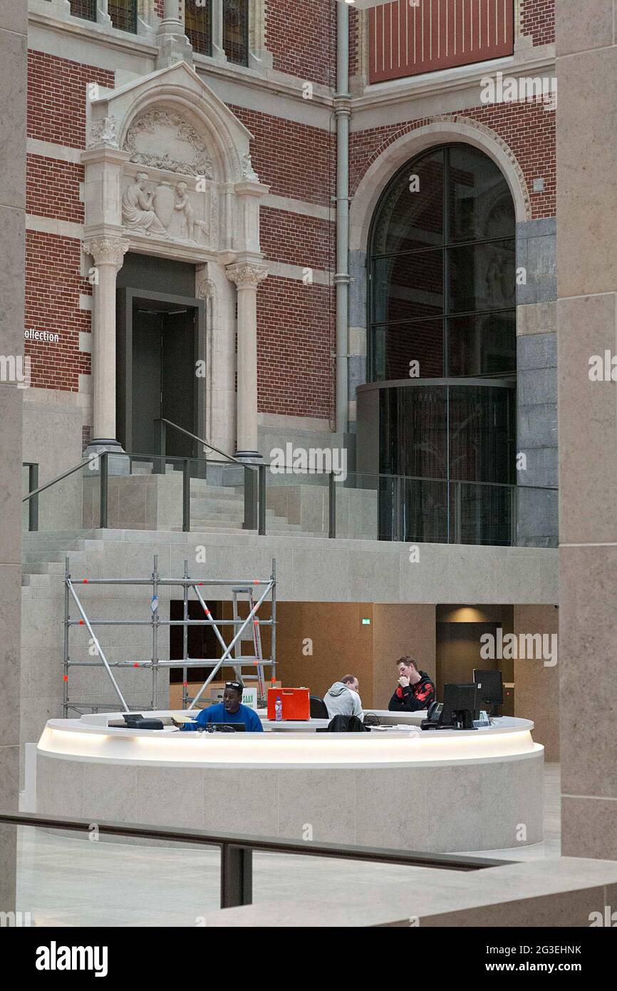 Construction of the information desk in Atrium West, upper left emboss ...