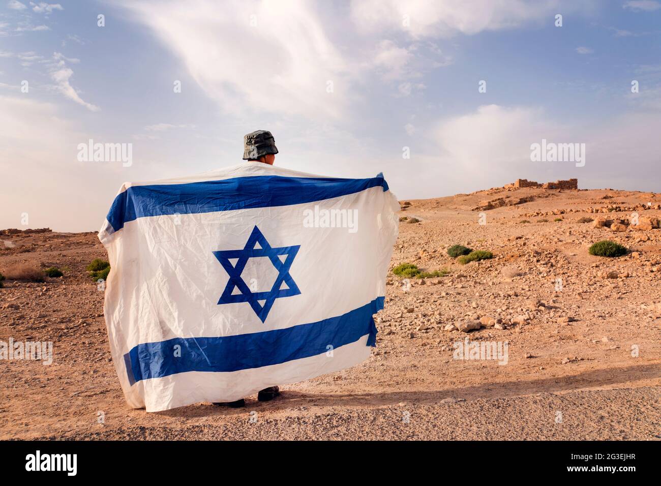 Israeli military infantry stands in the middle of the desert holding an ...