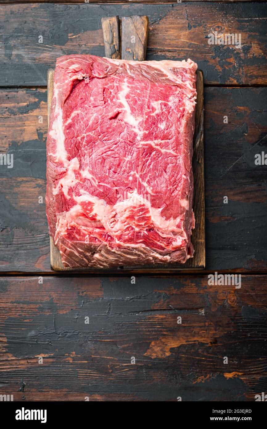 Veiny steak, marbled beef raw meat, on dark wooden background, top view ...