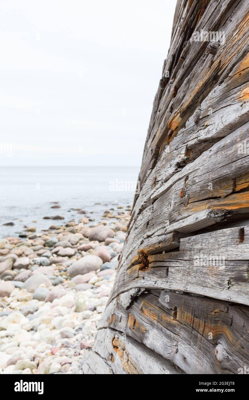 Old wooden shipwreck on a beach Stock Photo - Alamy