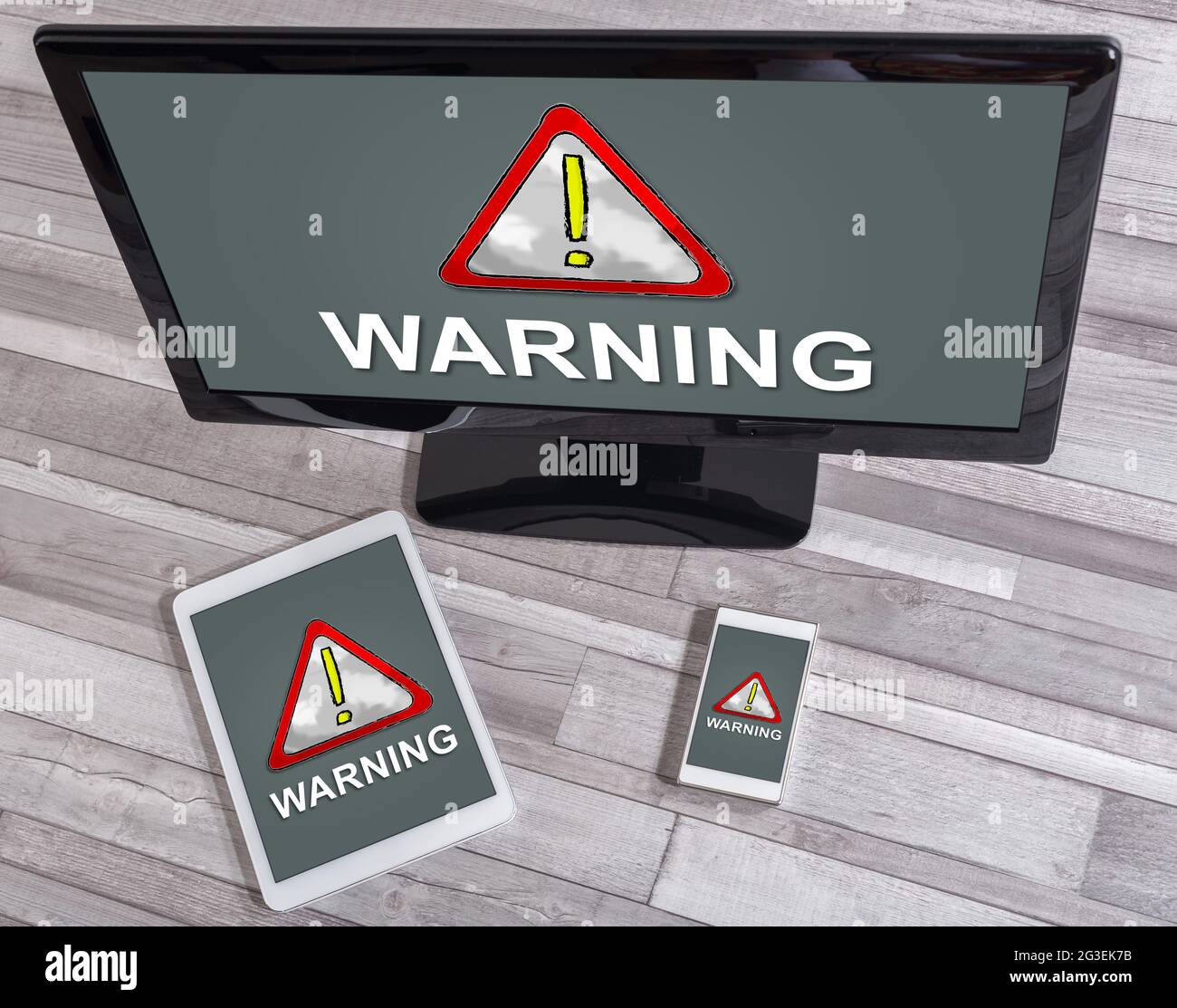 Warning concept shown on different information technology devices Stock ...