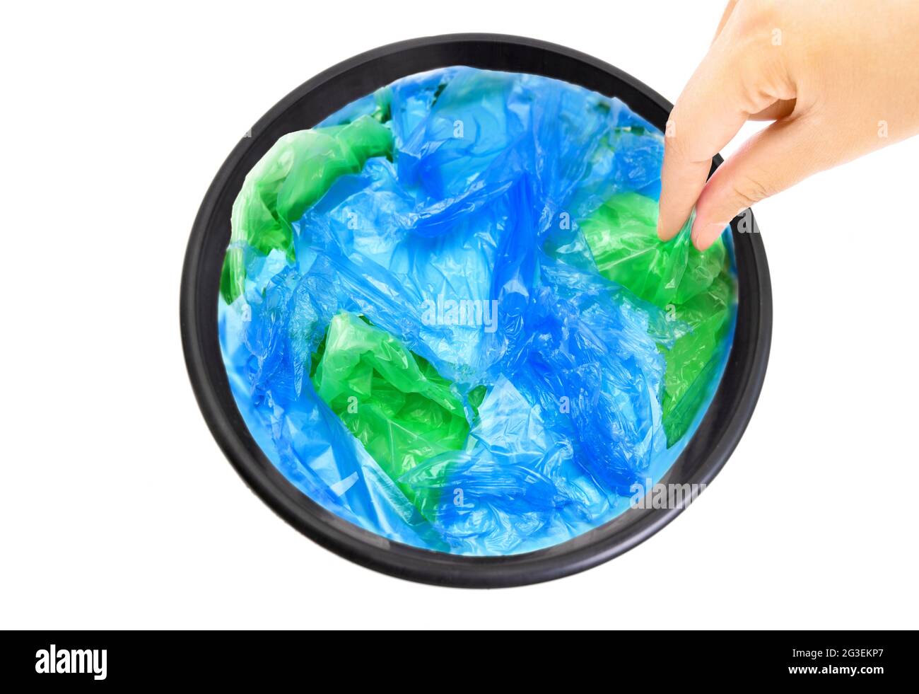 Human hand cleaning the earth globe made from plastic bags in a waste ...