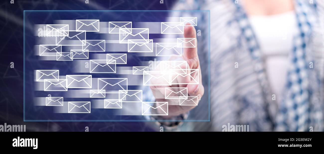 Woman touching an e-mail concept on a touch screen with her finger ...