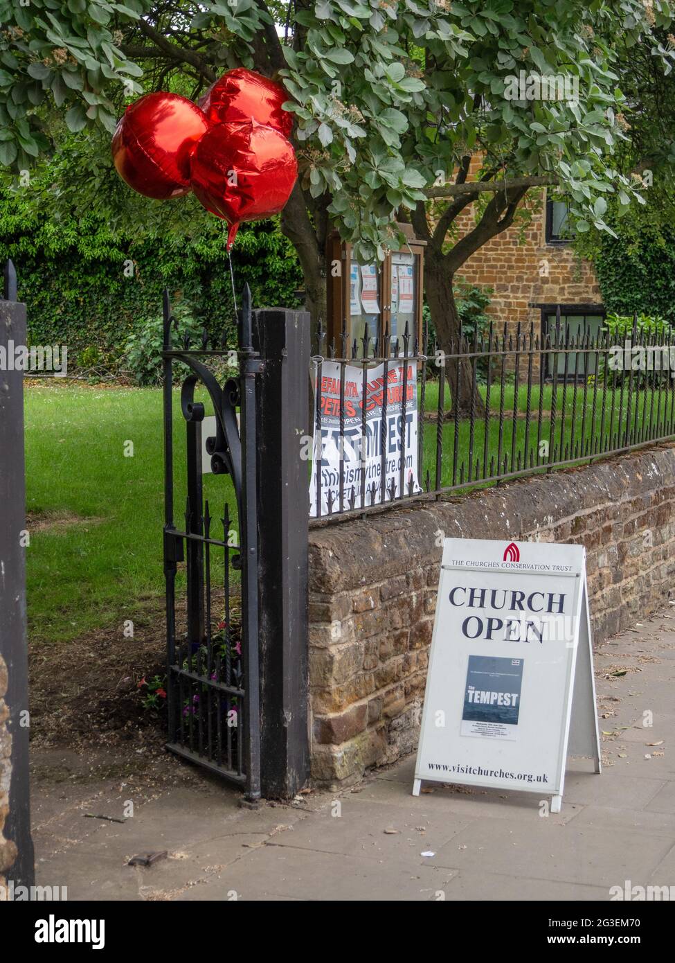 Church open sign and coloured balloons at the entrance to the Saxon ...