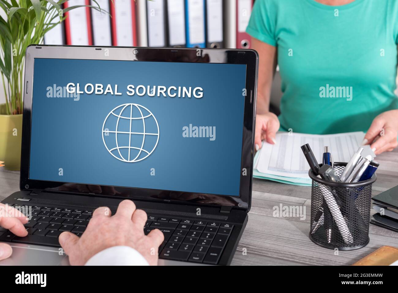 Laptop screen with global sourcing concept Stock Photo - Alamy