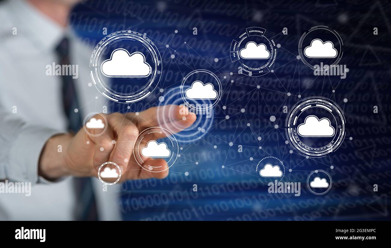 Man touching cloud networking concept on a touch screen with his finger ...