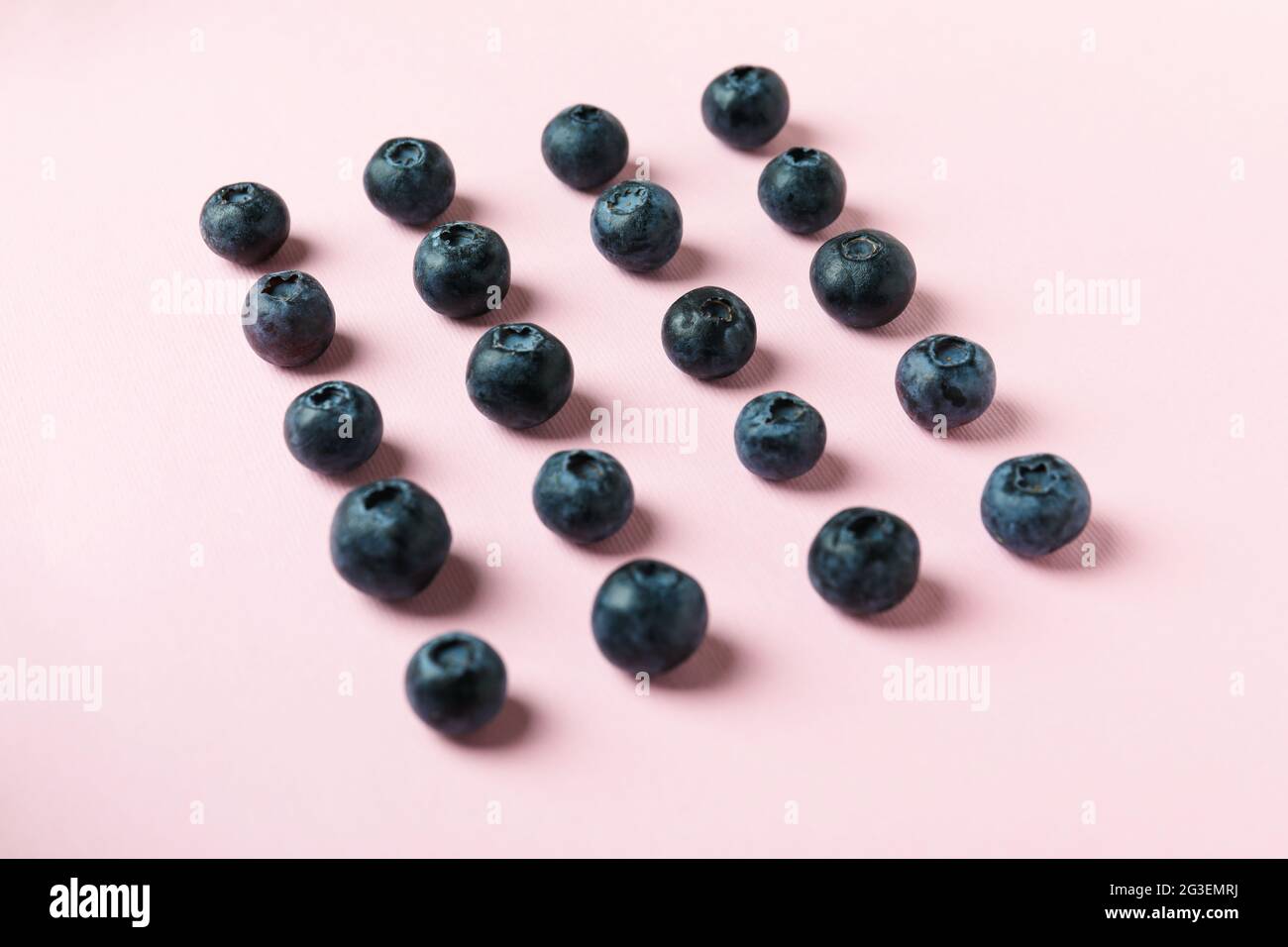 Fresh berry concept with blueberry on pink background Stock Photo - Alamy
