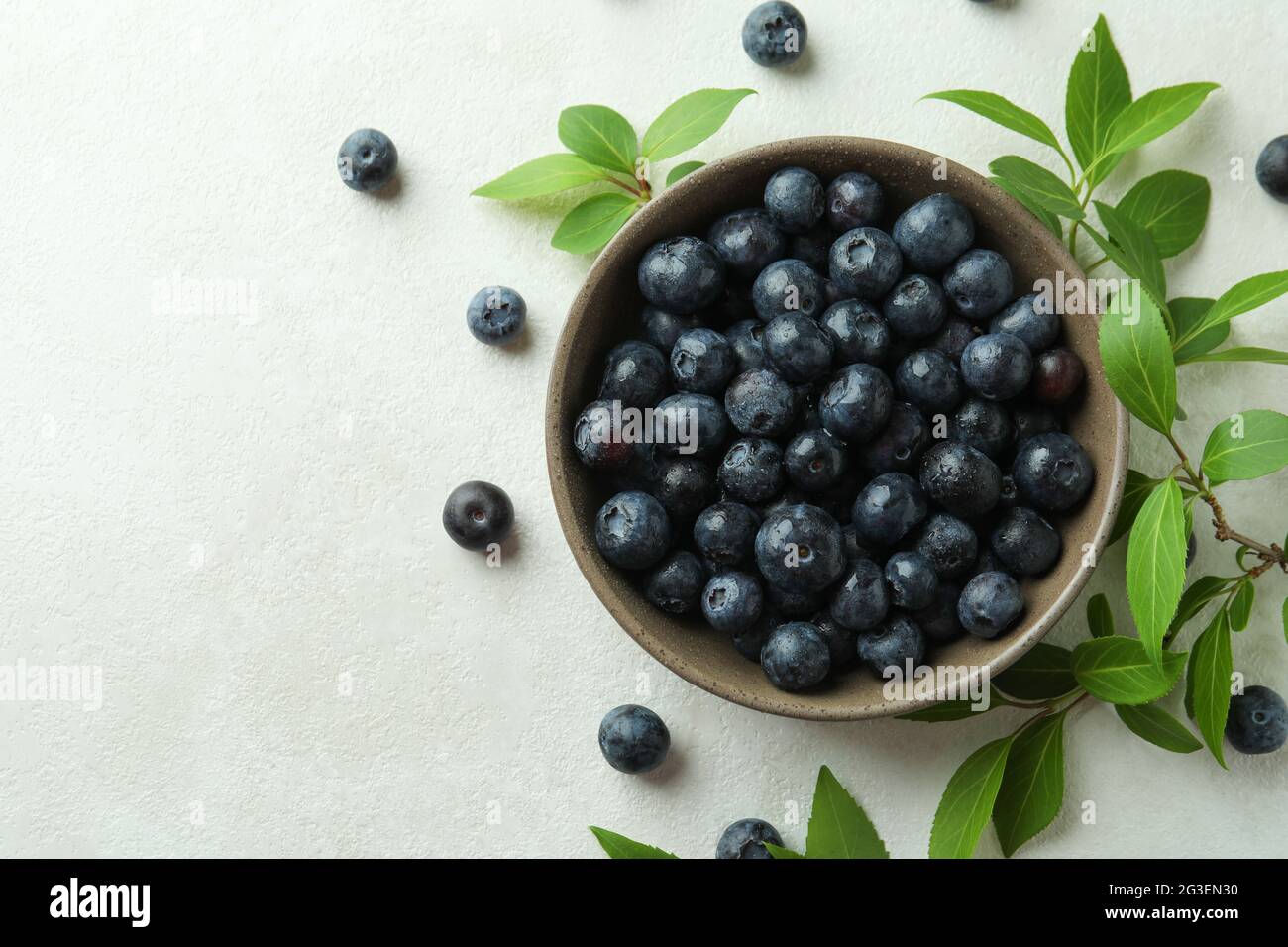 Fresh berry concept with blueberry on white textured table Stock Photo ...