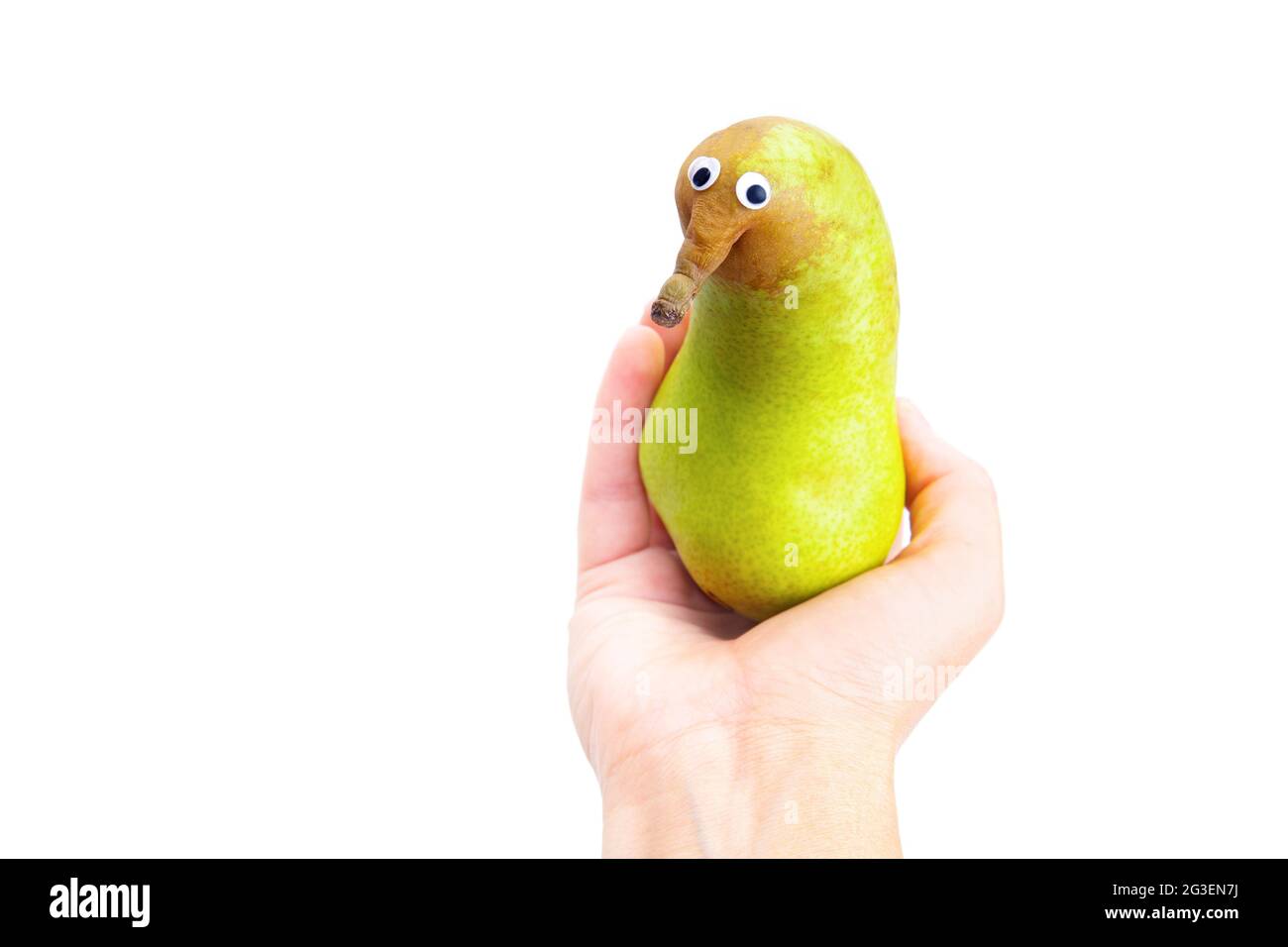 Cute pear character with a big nose and googly eyes in a female hand ...