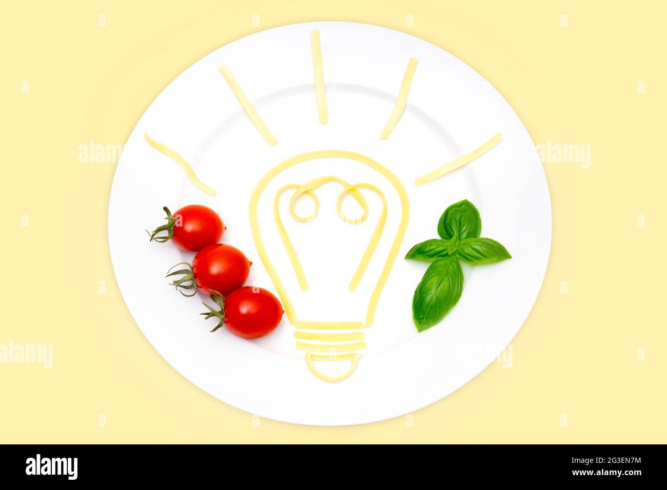 Creative food composition: top view of a white plate with a glowing ...