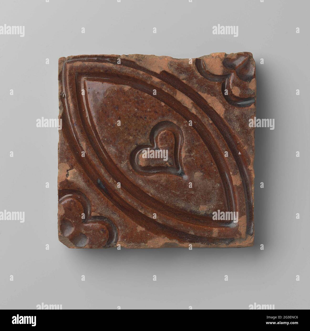 Tile with heart. Tile decorated with a heart surrounded by a double ...