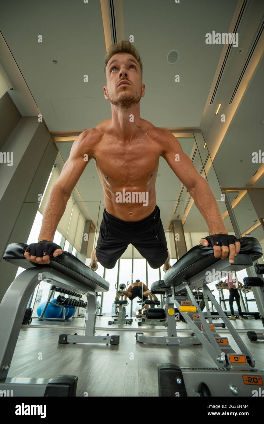 Handsome man with great body gym and pool Stock Photo - Alamy