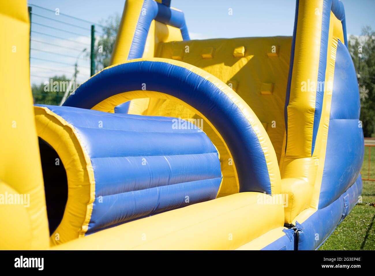 Inflatable obstacle course for fun. Inflatable structure in the park. A ...