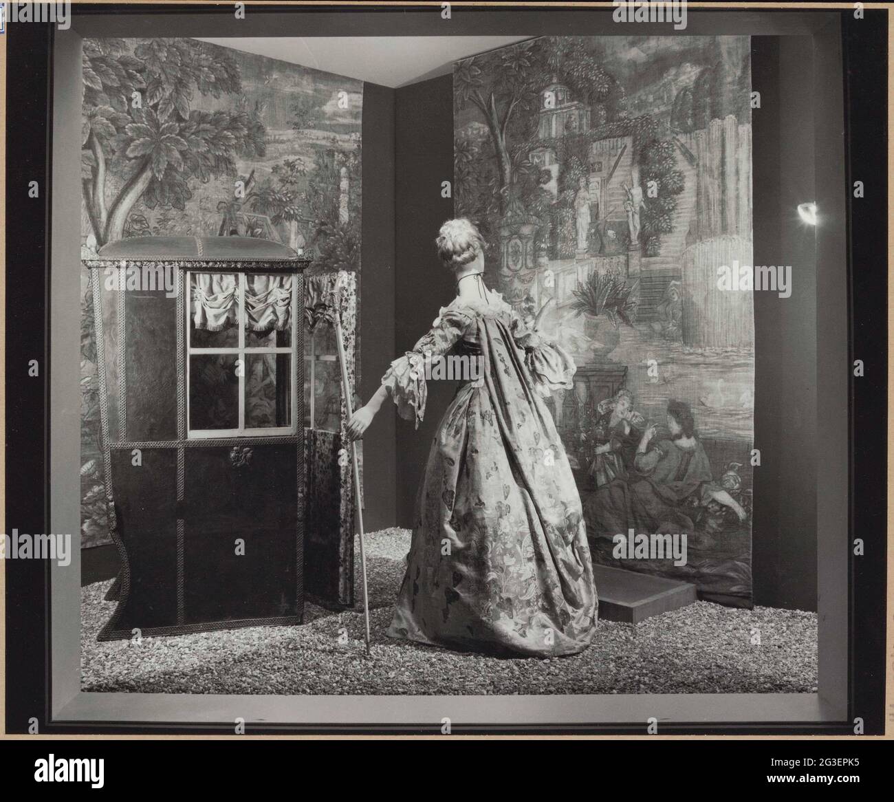 Showcase with doll with clothing in an interior; Arts and crafts 1962 ...