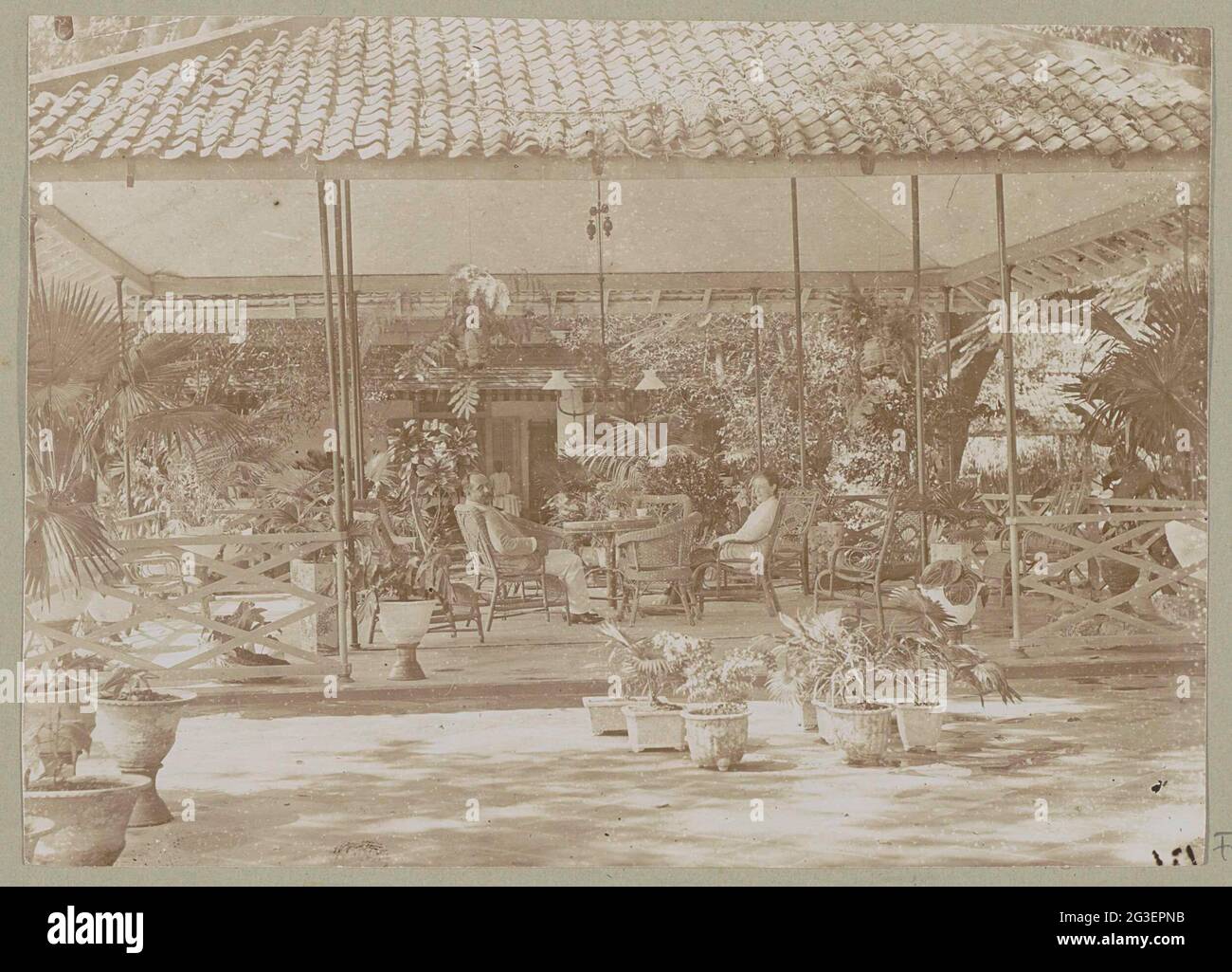 Dutch East Indies, couple sitting on veranda Stock Photo - Alamy