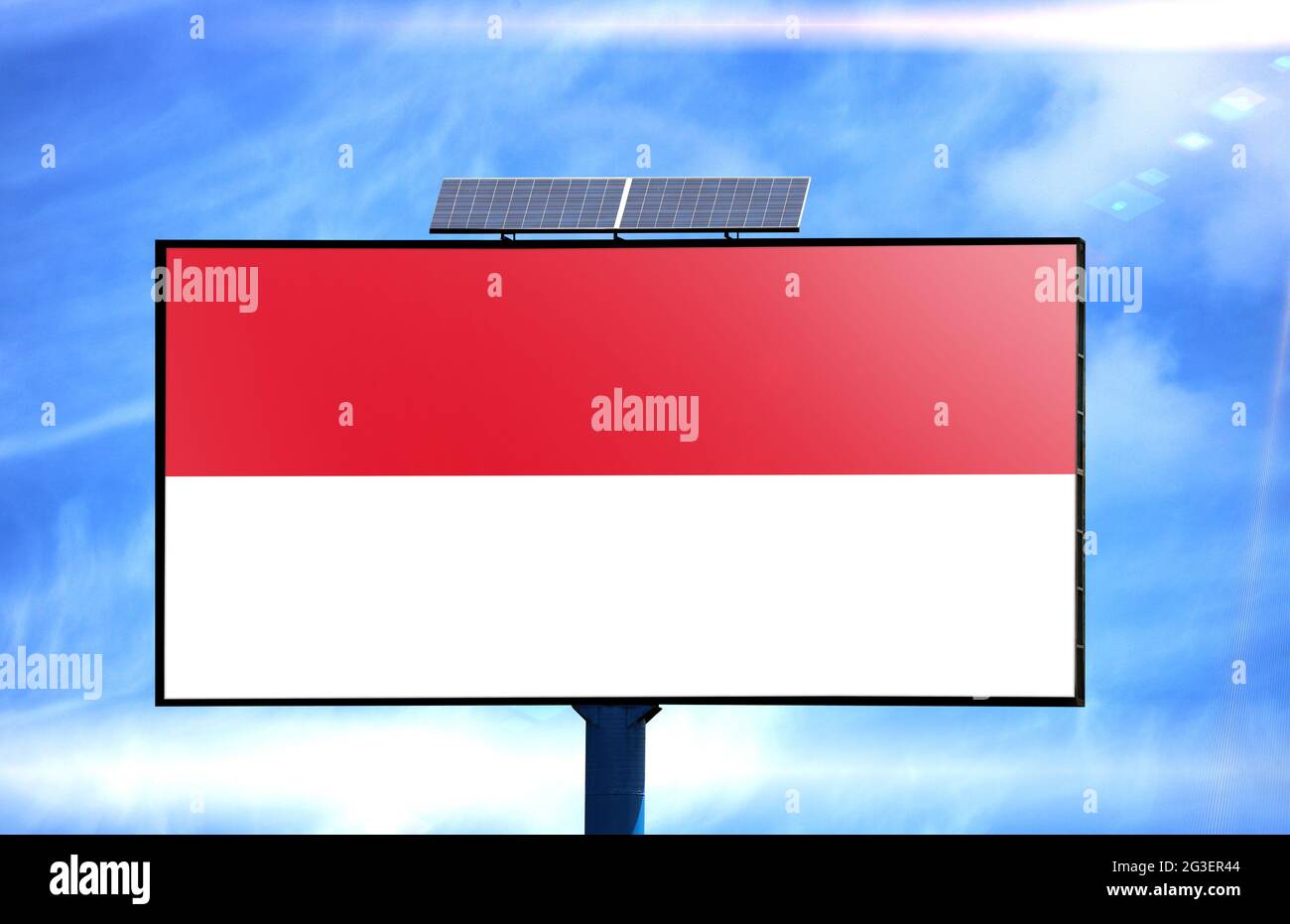Billboard with Monaco flag and solar battery on blue sky background ...