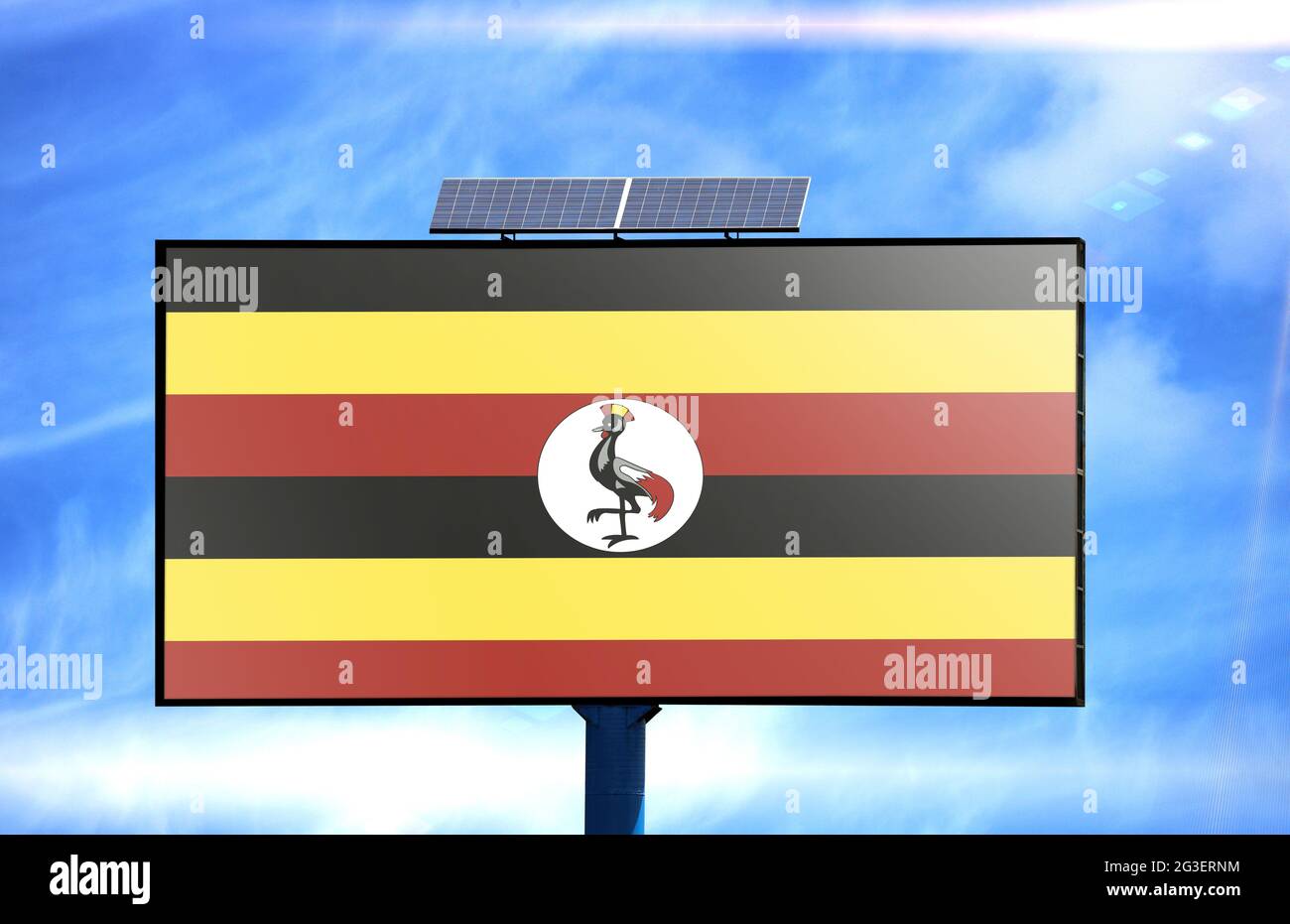 Billboard with Uganda flag and solar battery on blue sky background ...