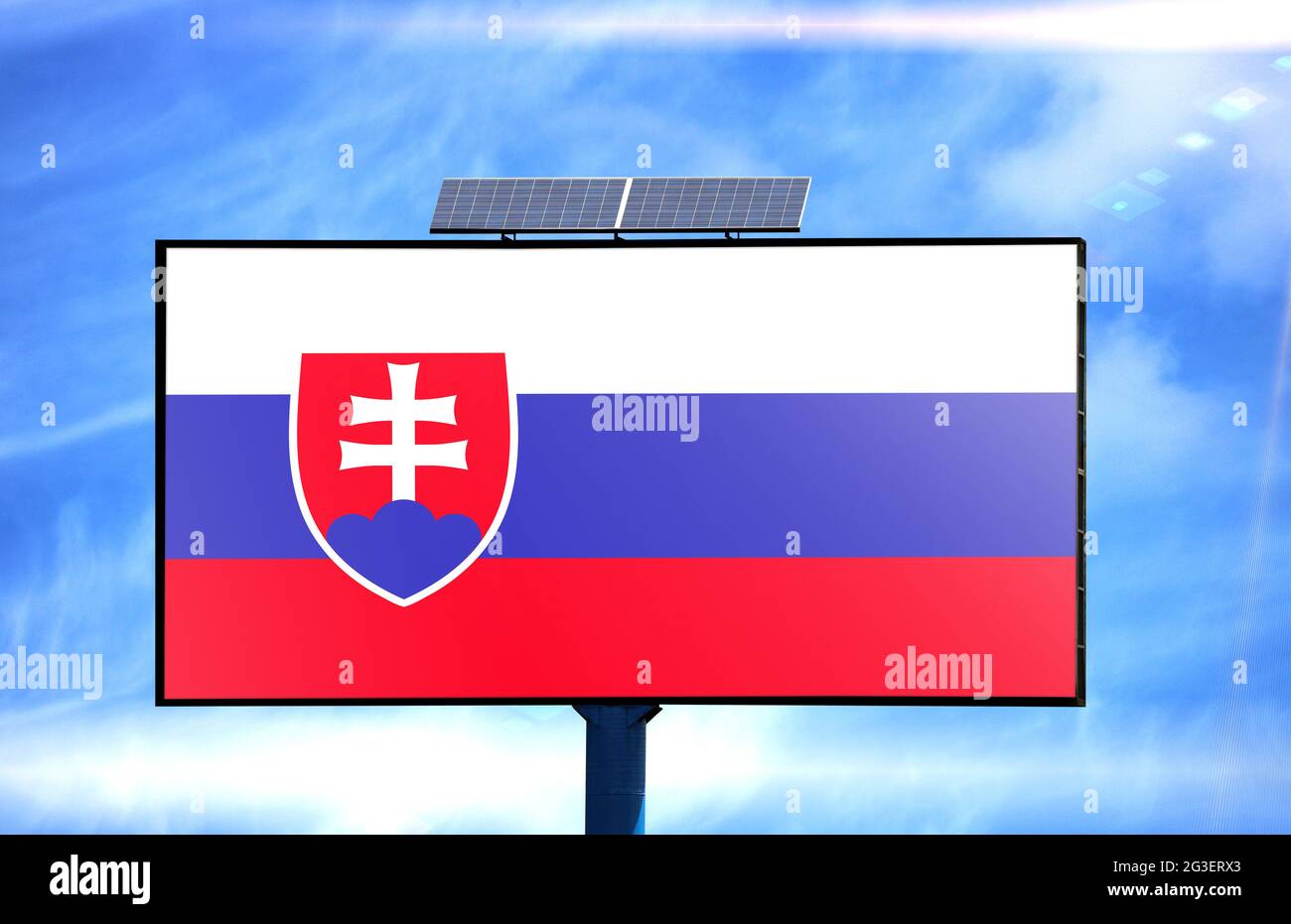 Billboard with Slovakia flag and solar battery on blue sky background ...