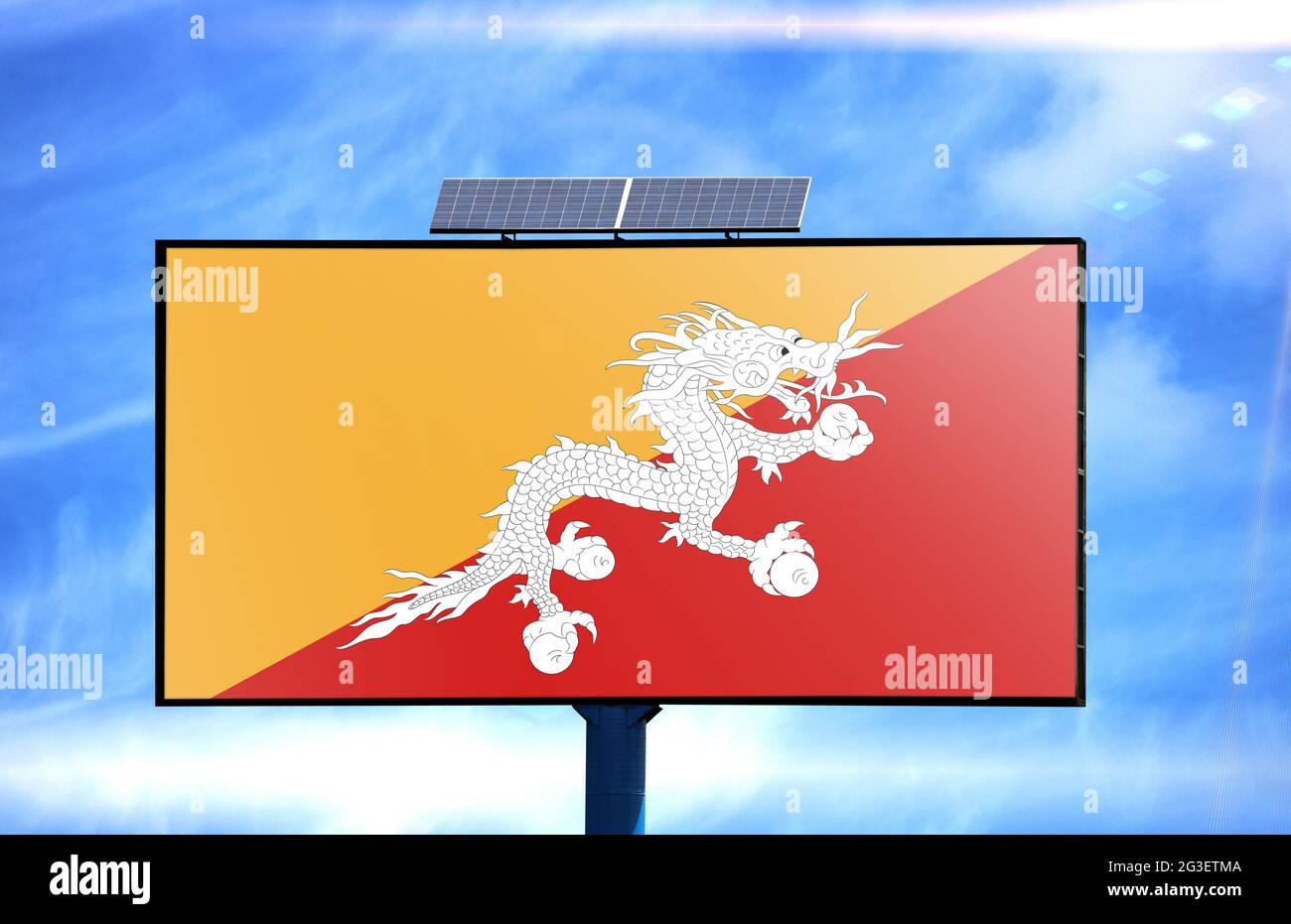 Billboard with Butane flag and solar battery on blue sky background ...