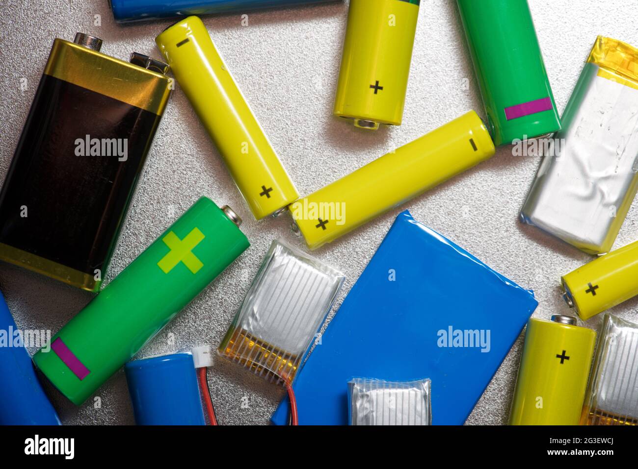 Colorful batteries on blue background hi-res stock photography and ...