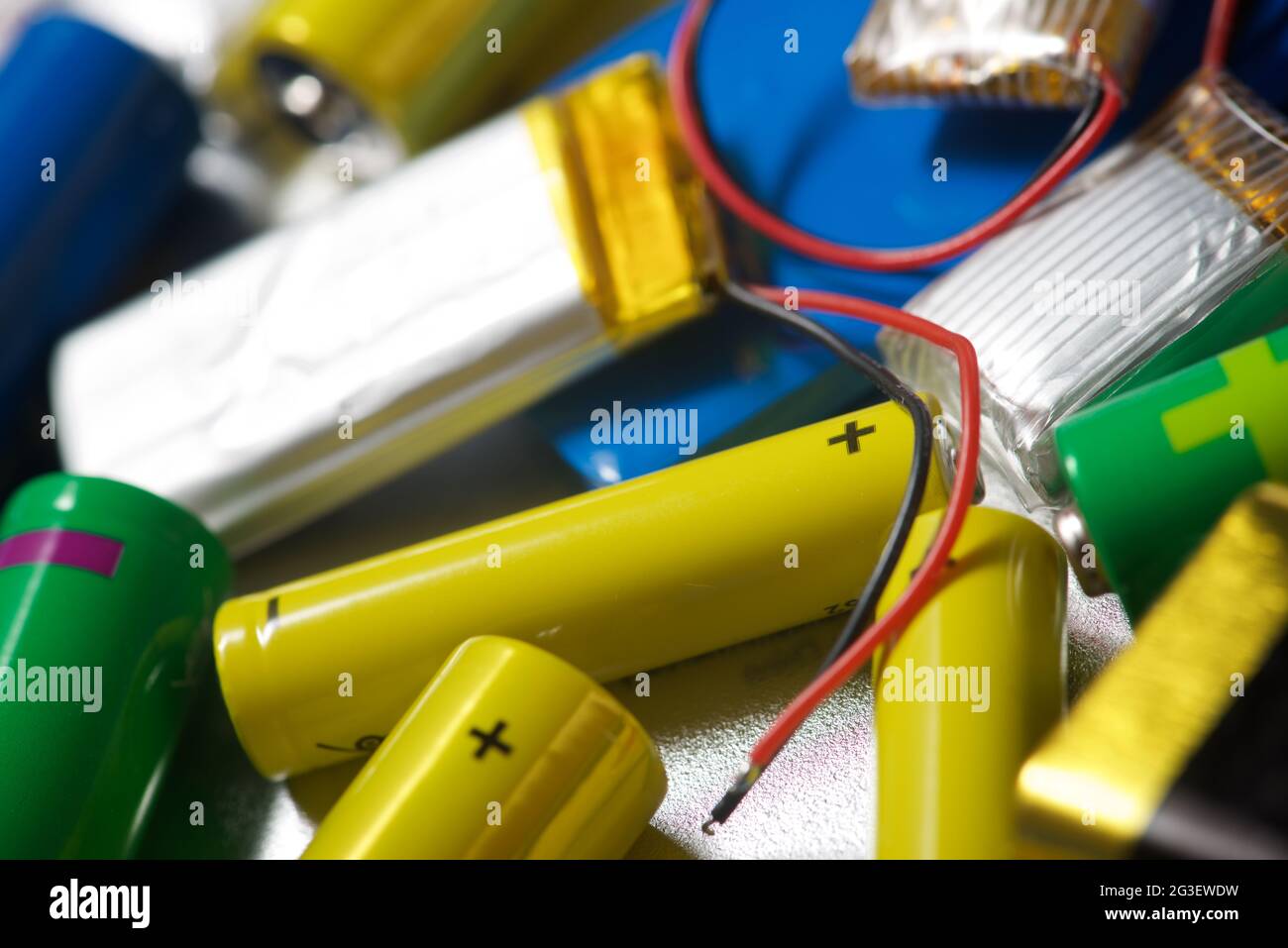 Colorful batteries on blue background hi-res stock photography and ...