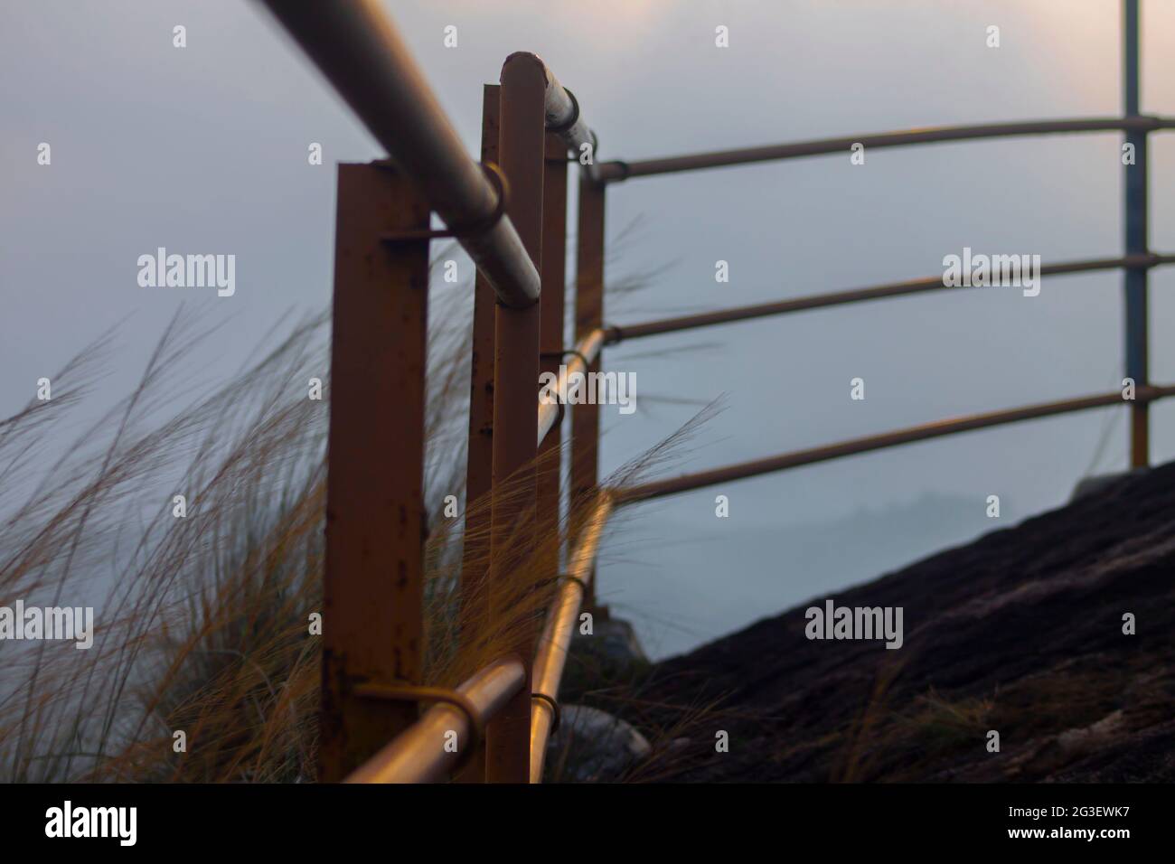 Handrails on a rock for safety purpose Stock Photo - Alamy