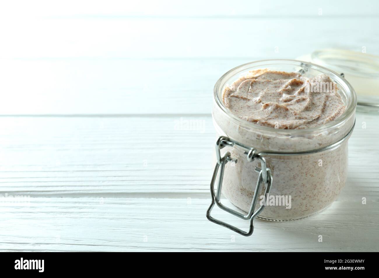 Skin care scrub on white wooden background Stock Photo - Alamy