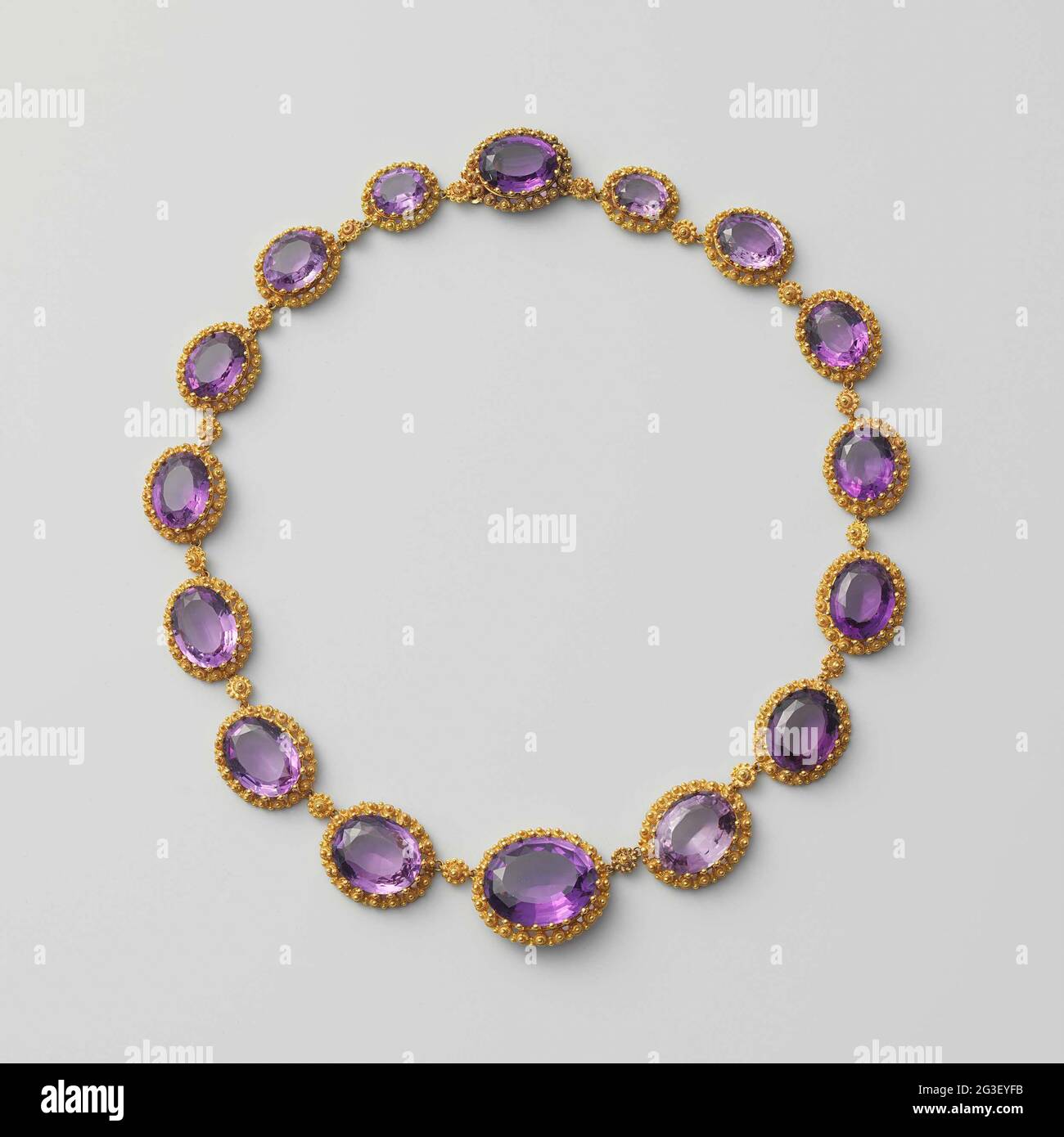 Gold necklace and amethyst. Gold necklace and amethyst. The stones are ...